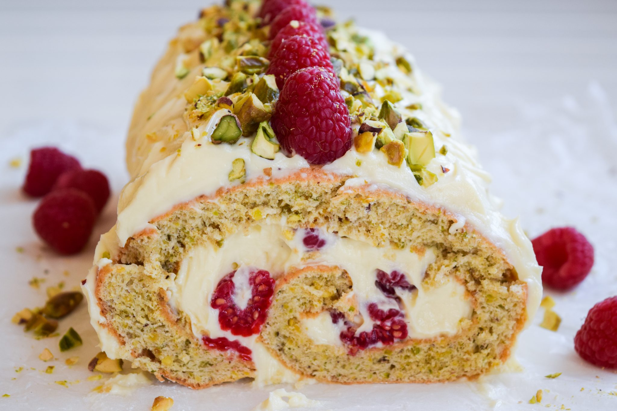Raspberry, Pistachio and White Chocolate Roulade | Rachel Phipps