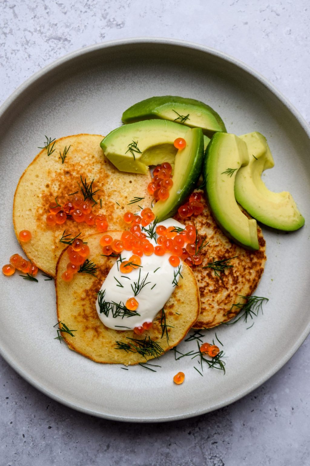 Matzo Meal Pancakes with Salmon Roe, Avocado & Soured Cream | Rachel Phipps